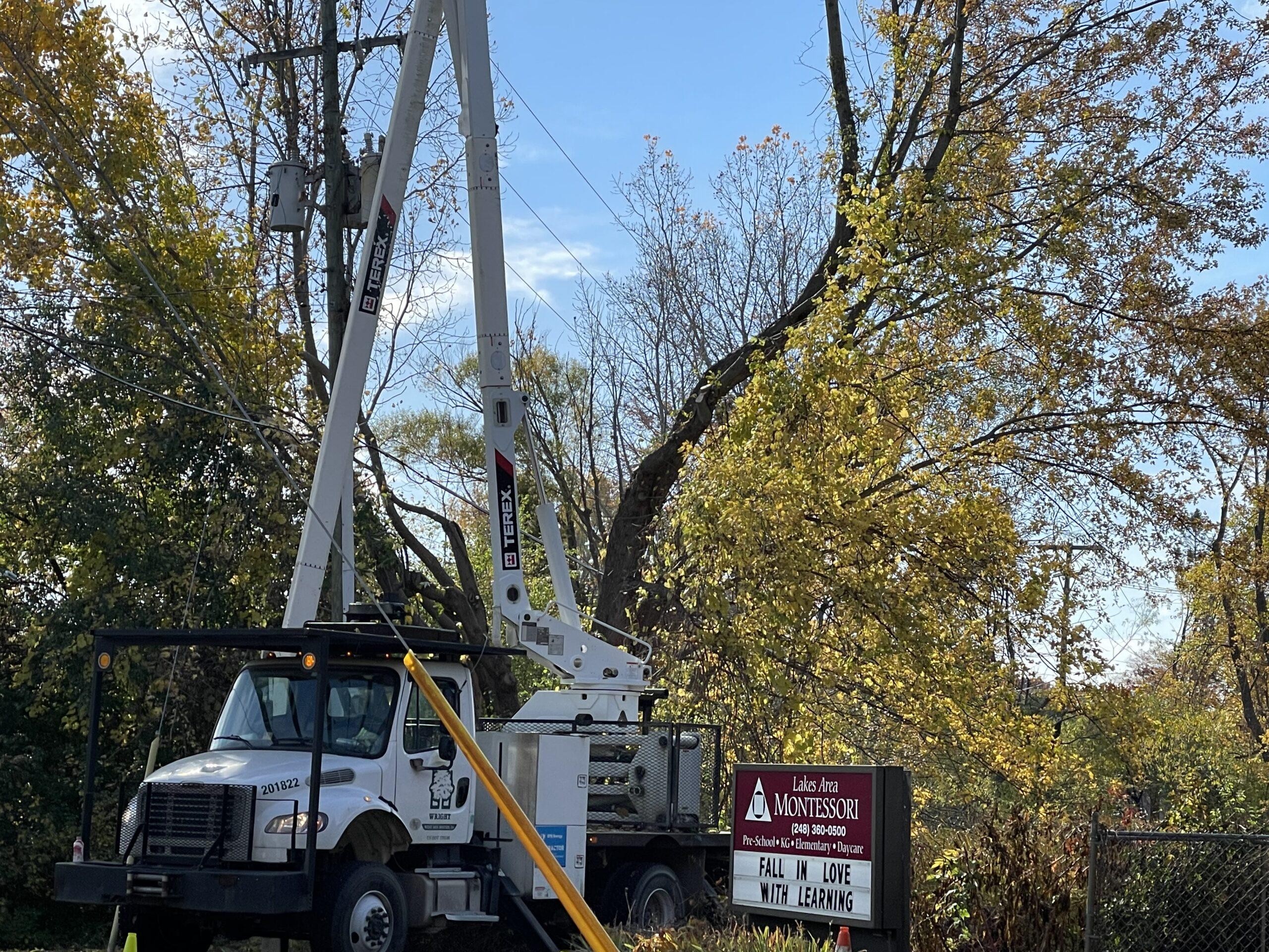 Tree trimming crews work near Lower Straits Lake - Empowering Michigan